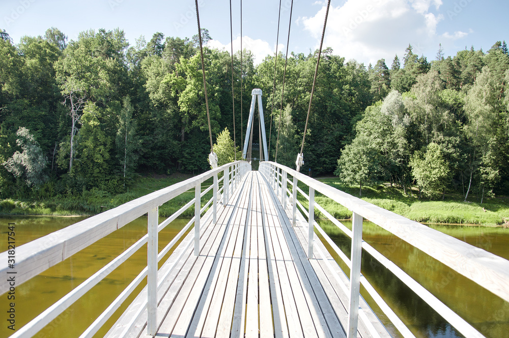 Pedestrian cable bridge over river Gauja in Sigulda. The bridge ...