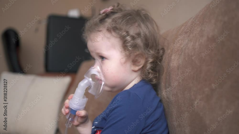 Nebulizer for inhalation, sick child breathes through nebulizer, baby ...