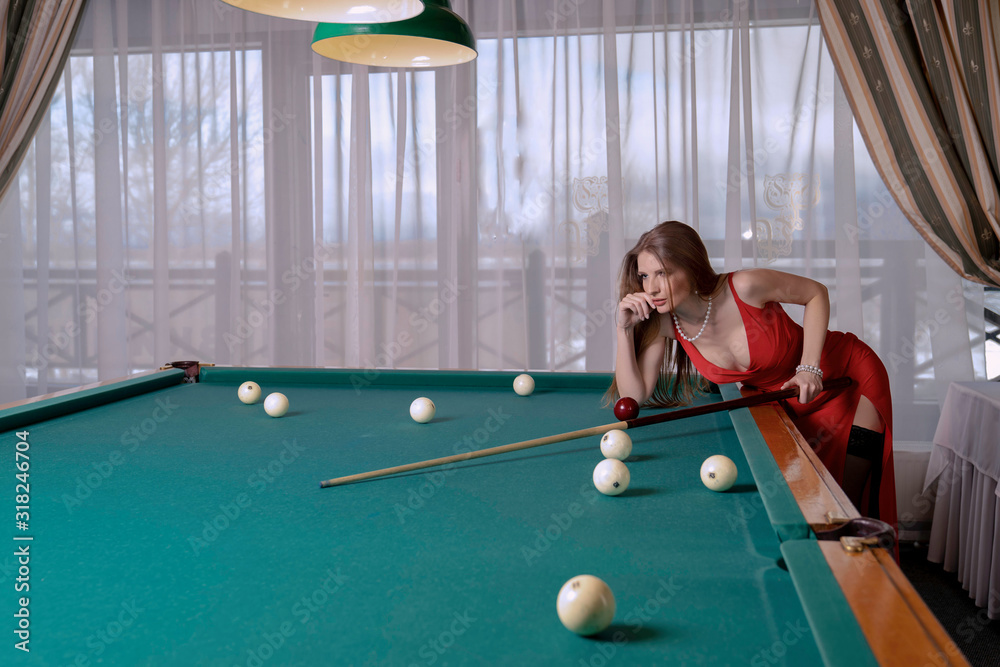 blonde girl with gorgeous breasts dressed in an elegant evening dress ...