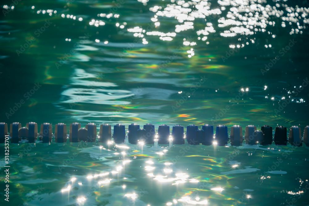 Swimming lane boundary in a pool, light reflections Stock Photo | Adobe ...