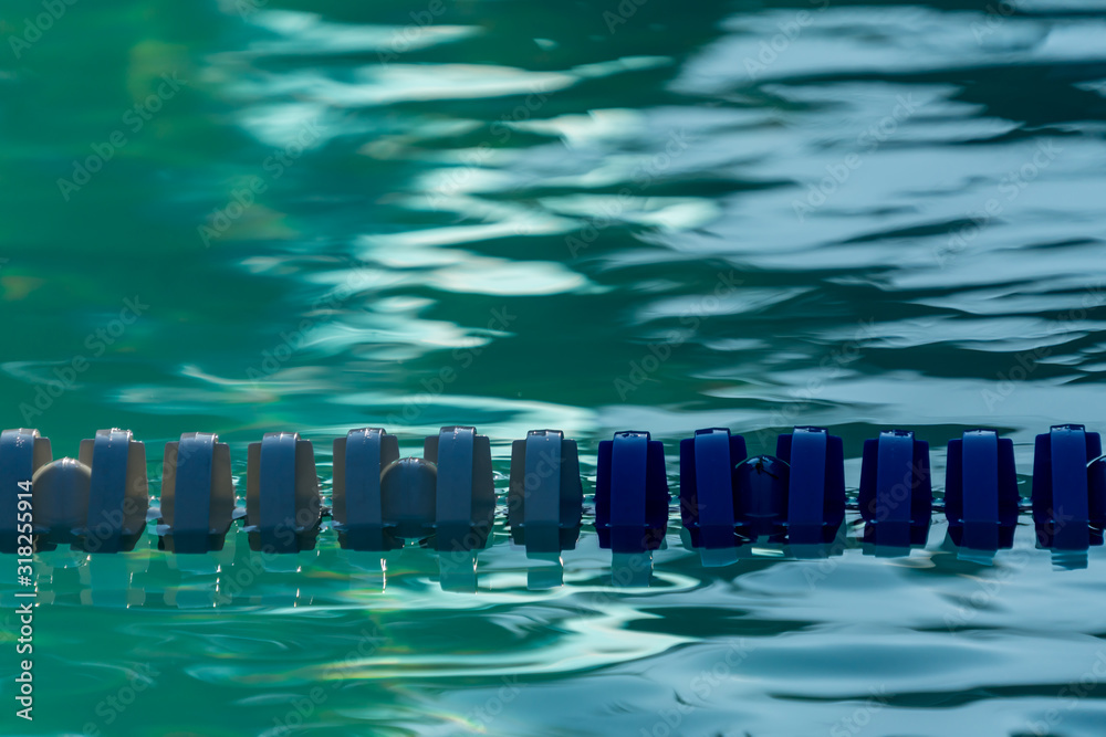 Swimming lane boundary in a pool, light reflections Stock Photo | Adobe ...