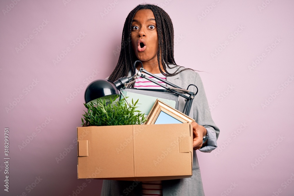 Young african american worker girl holding office cardboard fired from ...