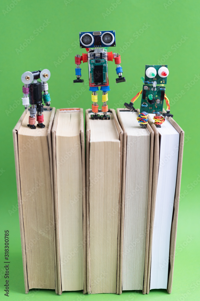 Hand made robot working on the arduino platform with books. Green ...