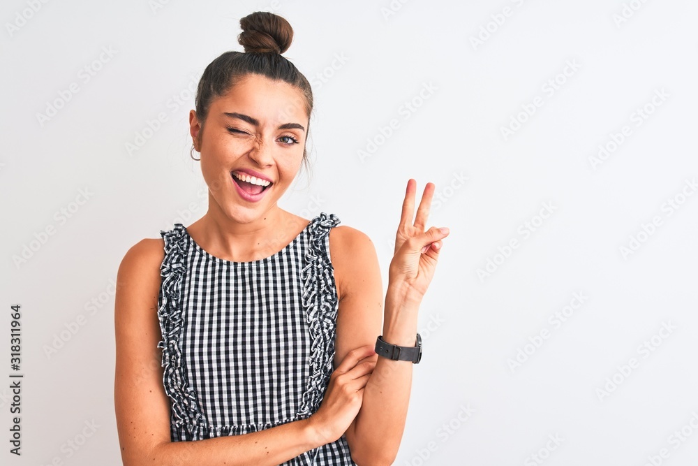 Beautiful Woman With Bun Wearing Casual Dresss Standing Over Isolated