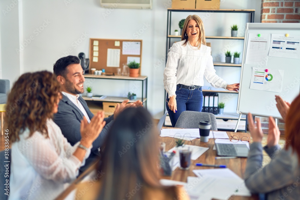 Group of business workers working together in a meeting. One of them ...