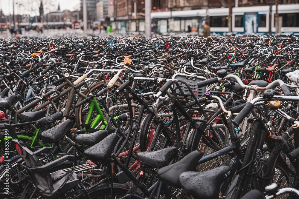 Big bicycle parking with lot of bicycles, rayny day, iconic transport ...