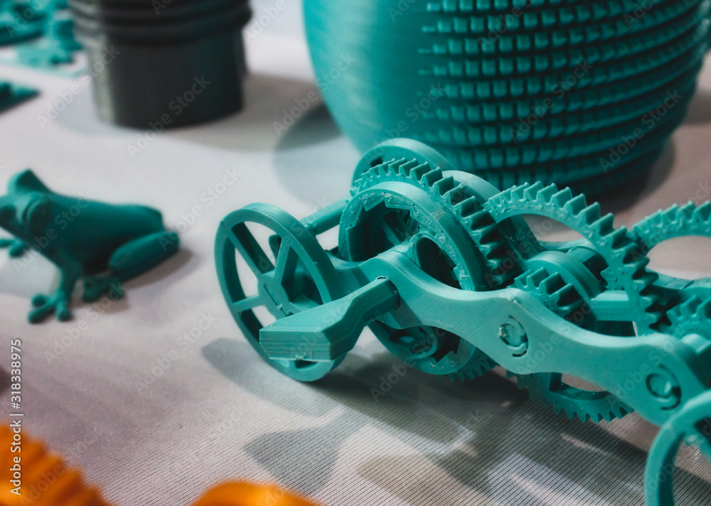 Various 3D printed model objects on a table Stock Photo | Adobe Stock