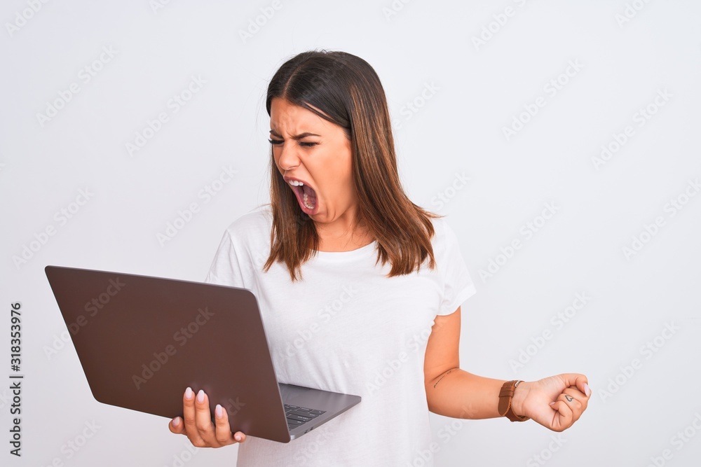 Beautiful young woman working using computer laptop over white ...