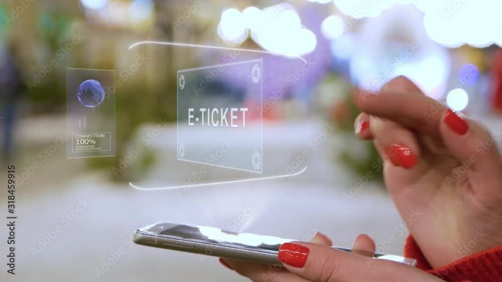 Female hands interact with HUD hologram text E-ticket. Woman with red ...