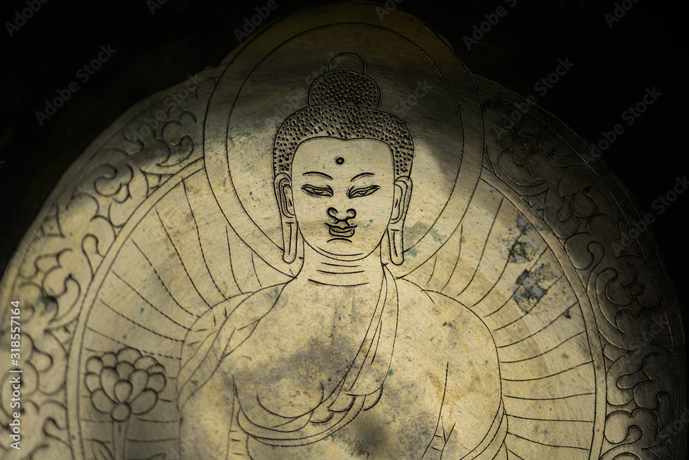A carved depiction of the Buddha Stock Photo | Adobe Stock