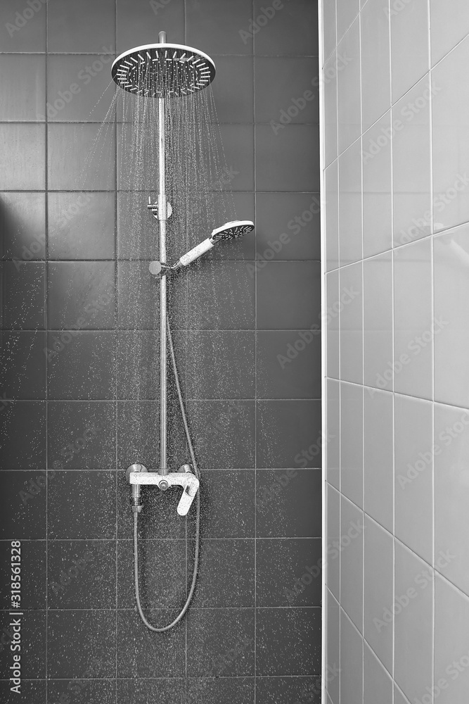 water flows from the shower in bathroom Stock Photo | Adobe Stock