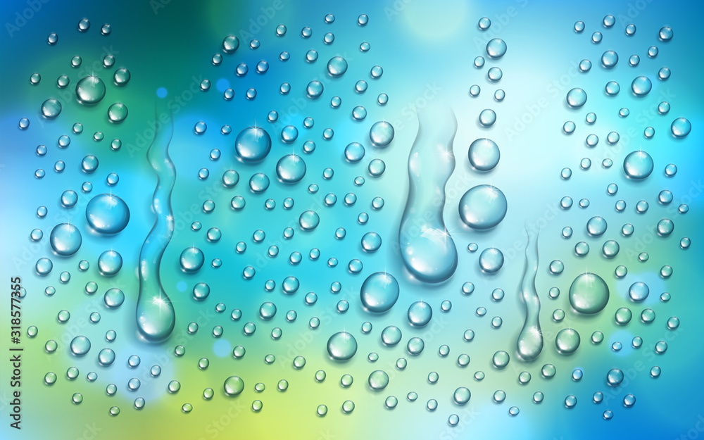 Water rain drops or condensation over blurred green and blue nature ...