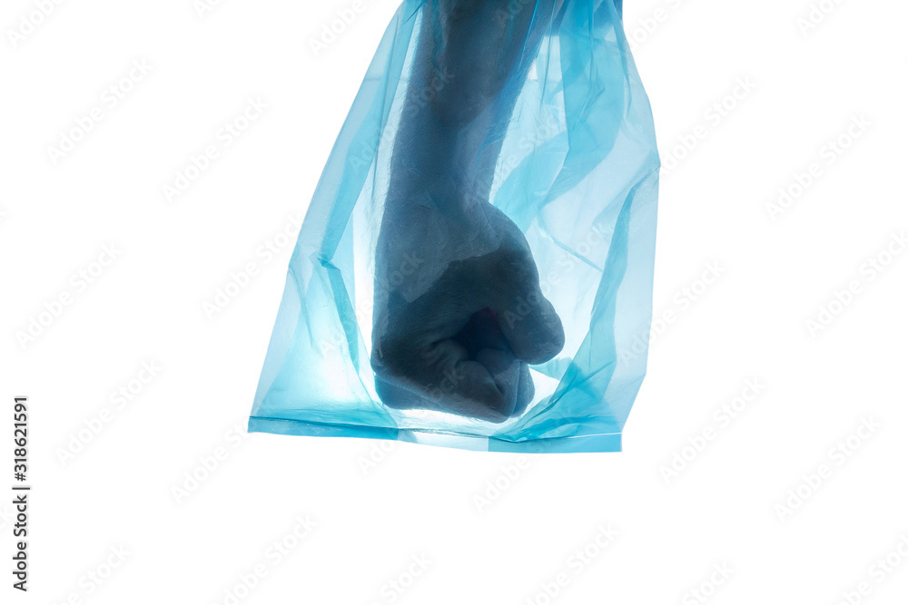 Silhouette of hand try to punch through blue plastic bag isolated on ...