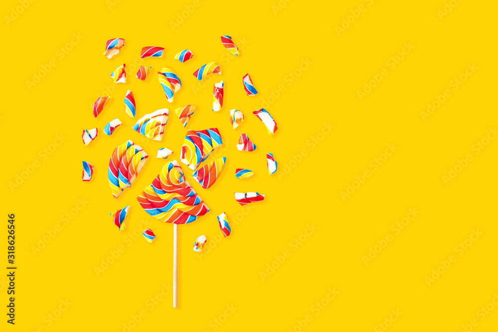 Scattered lollipop explosion. Colorful lollipops swirl on stick ...