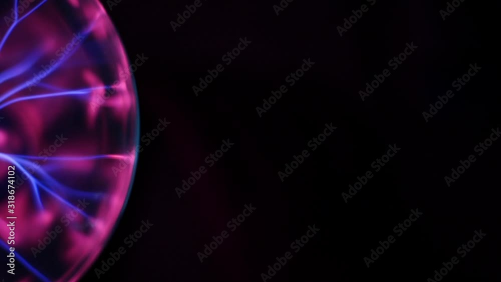 Moving sphere of Plasma lightning ball in a dark, Tesla discharge lamp ...