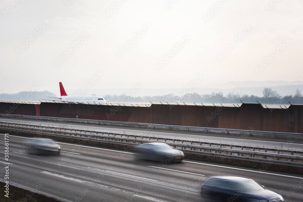 Highway and airport side by side. Airplane on runway and cars Stock ...