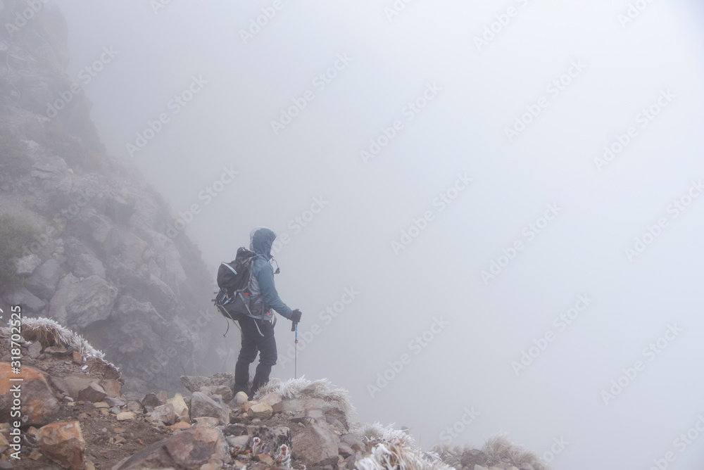 Hiking in the mountain Nevado de Colima Nacional park, at top peak over ...