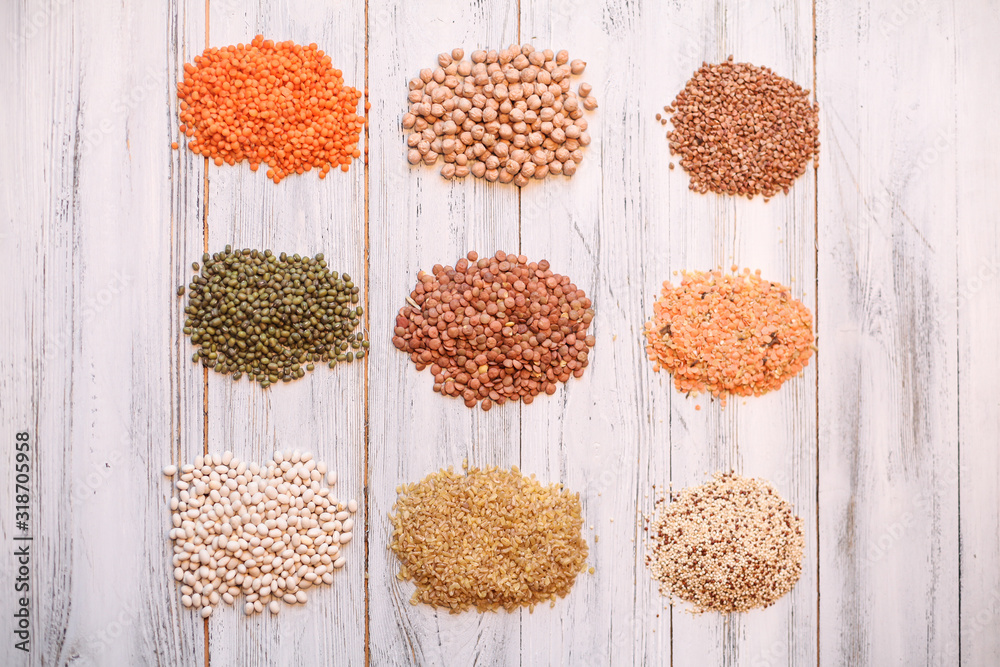 piles of various legumes (chickpeas, green peas, red lentils, buckwheat ...