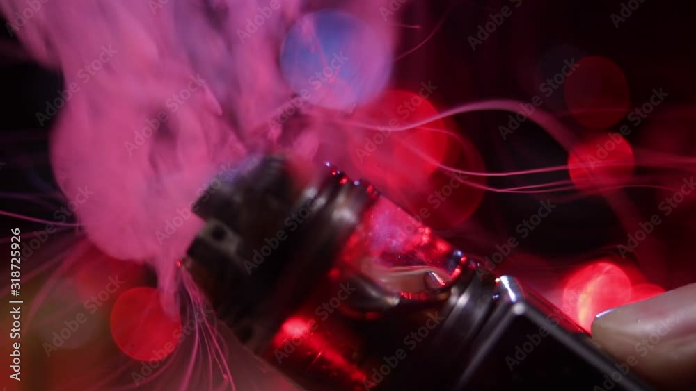 Vape concept. Electronic Cigarette vape explosion. Smoke clouds and ...