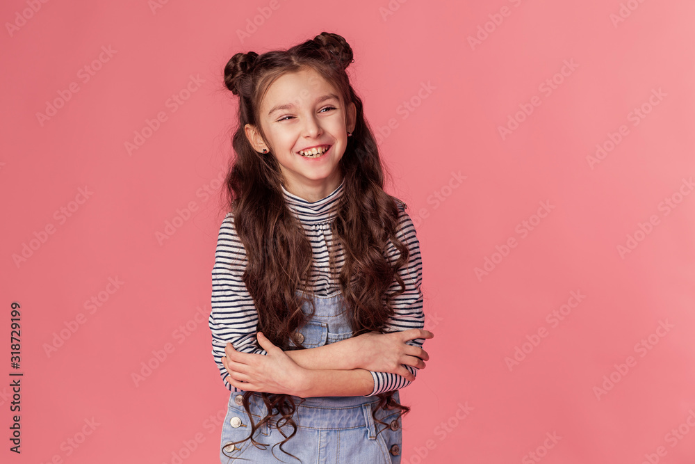 Girl 7 years old schoolgirl with long hair brunette sincerely laughs ...