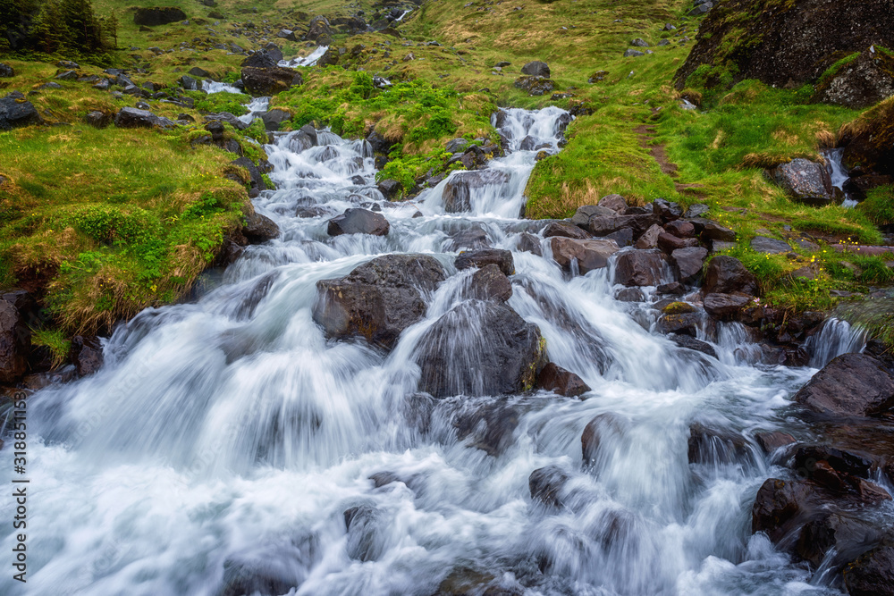 Beautiful nature landscape with flowing water of the fast stream ...