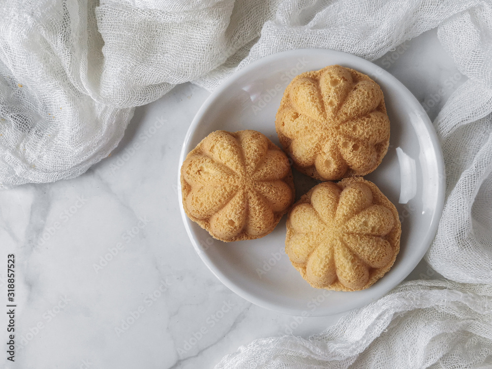 White photoshoot of baulu cakes in the form of star gooseberry. A malay ...