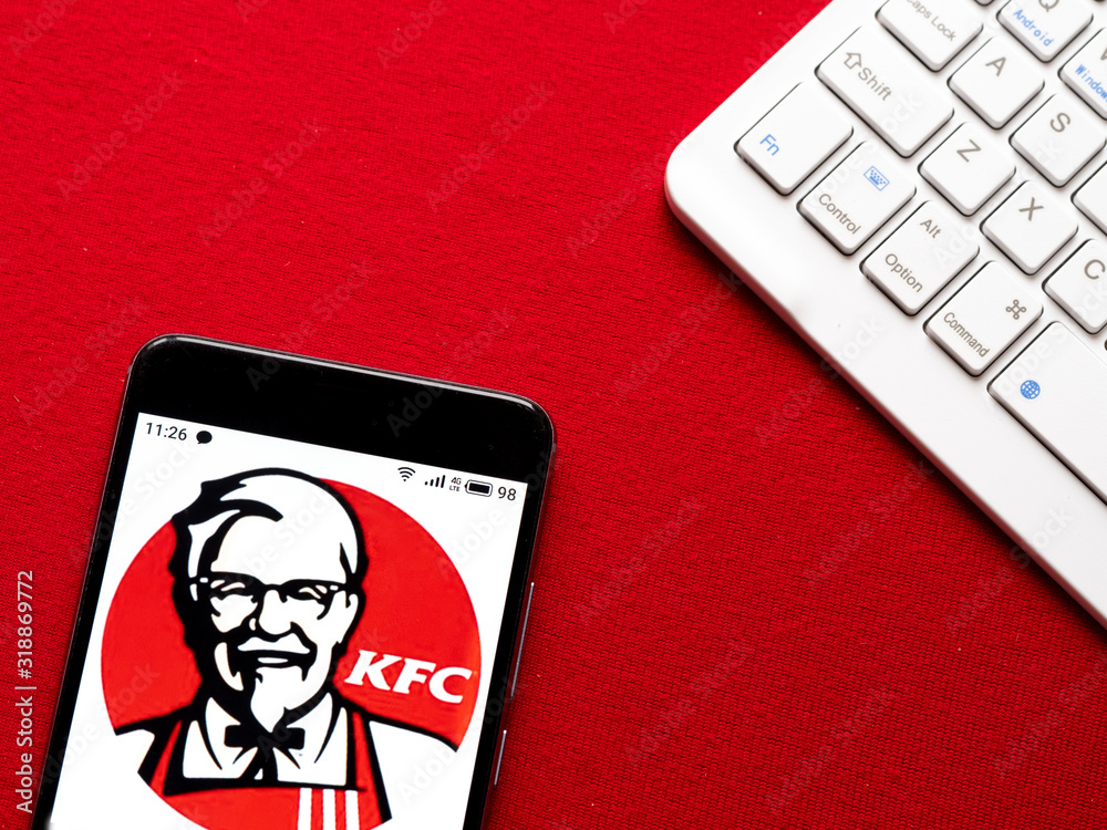 In this photo illustration the KFC logo is seen displayed on a ...