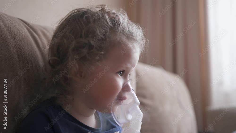 Nebulizer for inhalation, sick child breathes through nebulizer, baby ...