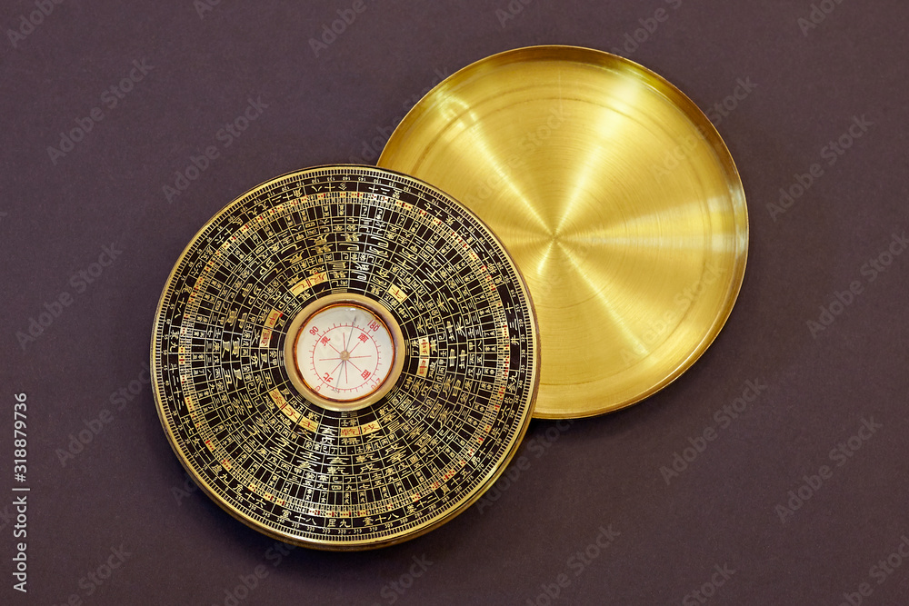 Old vintage chinese compass used in feng shui, golden item with ...