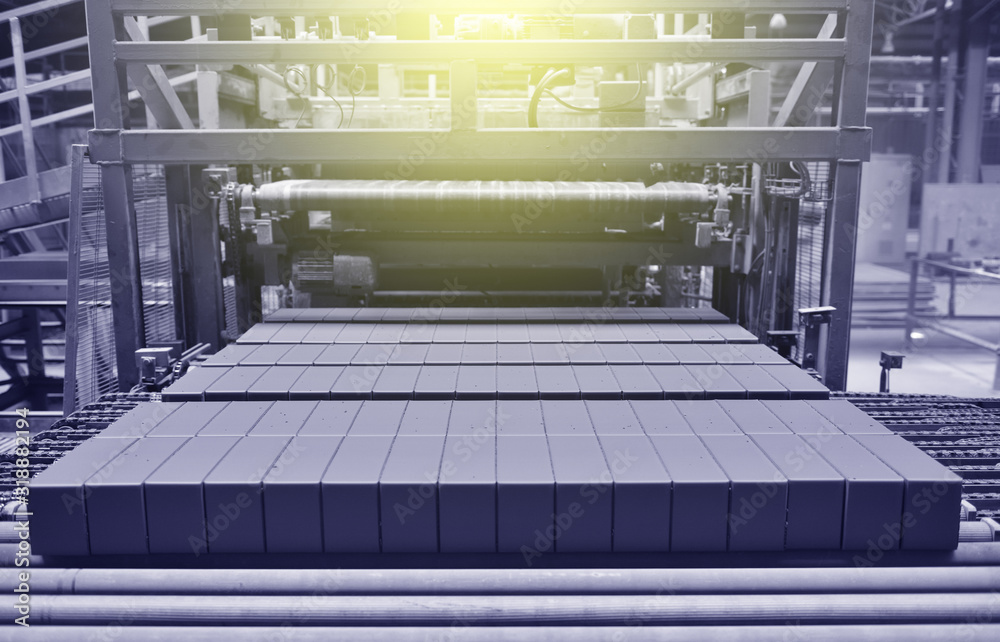 Brick production. New bricks on a conveyor belt at a brick factory ...