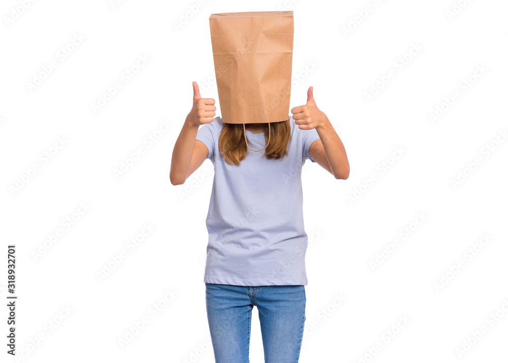 Portrait of teen girl with paper bag over head making thumb up gesture ...