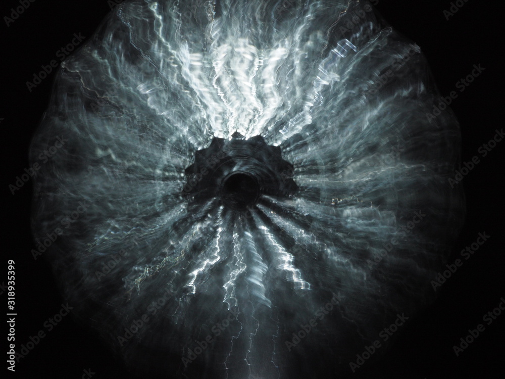 Blurry abstract silver star exploding in the darkness. Silver abstract ...