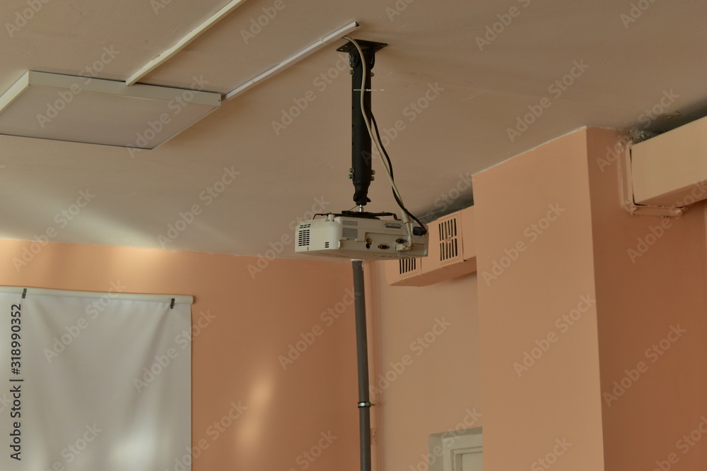 School classroom with desks and a projector Stock Photo | Adobe Stock