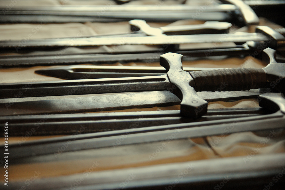 medieval forged steel knightly sword close-up. knight and armor concept ...