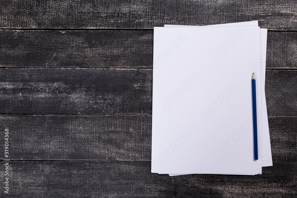 A4 white paper with pen on wooden background. Blank branding template ...