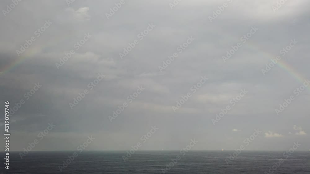 Rainbow in the ocean after rain and thunderstorms. Nice views of the ...