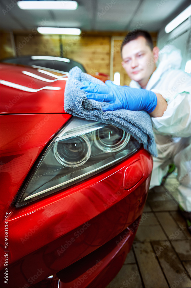 Preparing the car for sale at a service station. Stock Photo | Adobe Stock