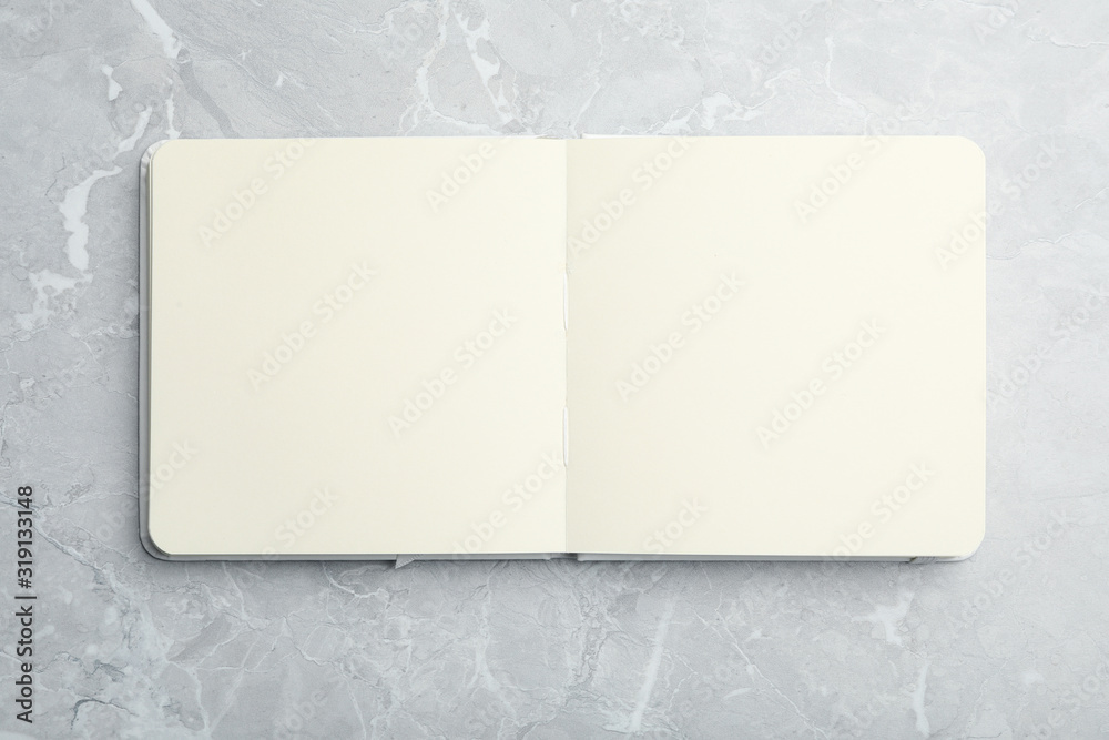Stylish open notebook on marble table, top view. Space for design Stock ...