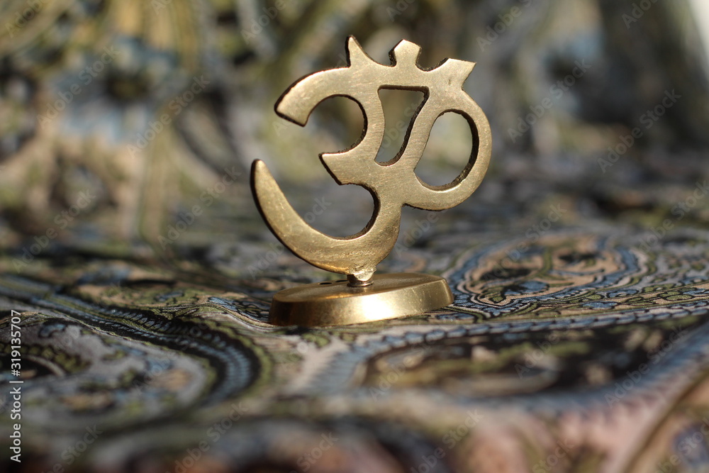 Figure of golden indian symbol aum. Stock Photo | Adobe Stock