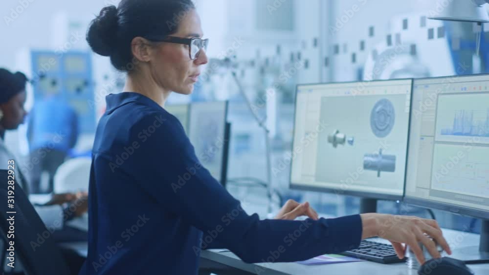 Diverse Team of Industrial Engineers Working in Glass Office, using PC ...