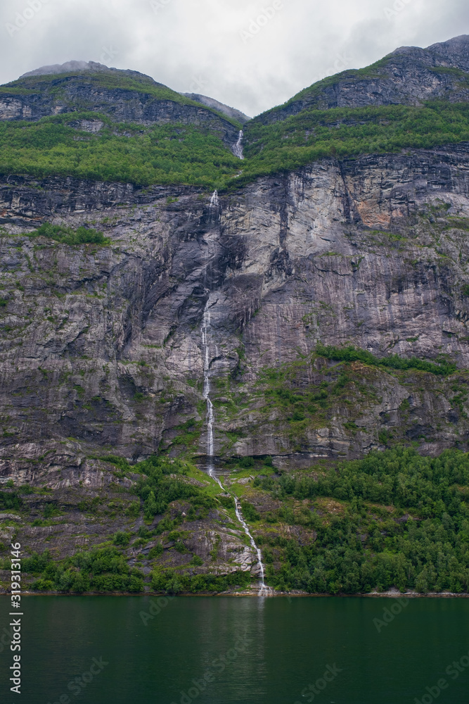 Little waterfall. Views inside the Geiranger fjord taken by the ferry ...