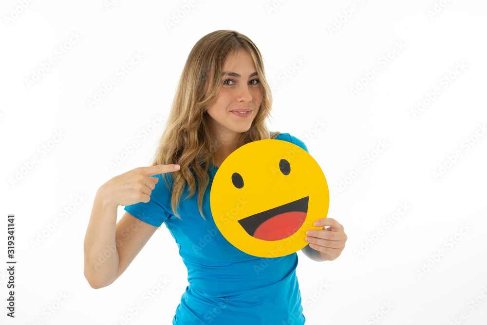Beautiful young woman holding happy face emoji emoticon social media ...