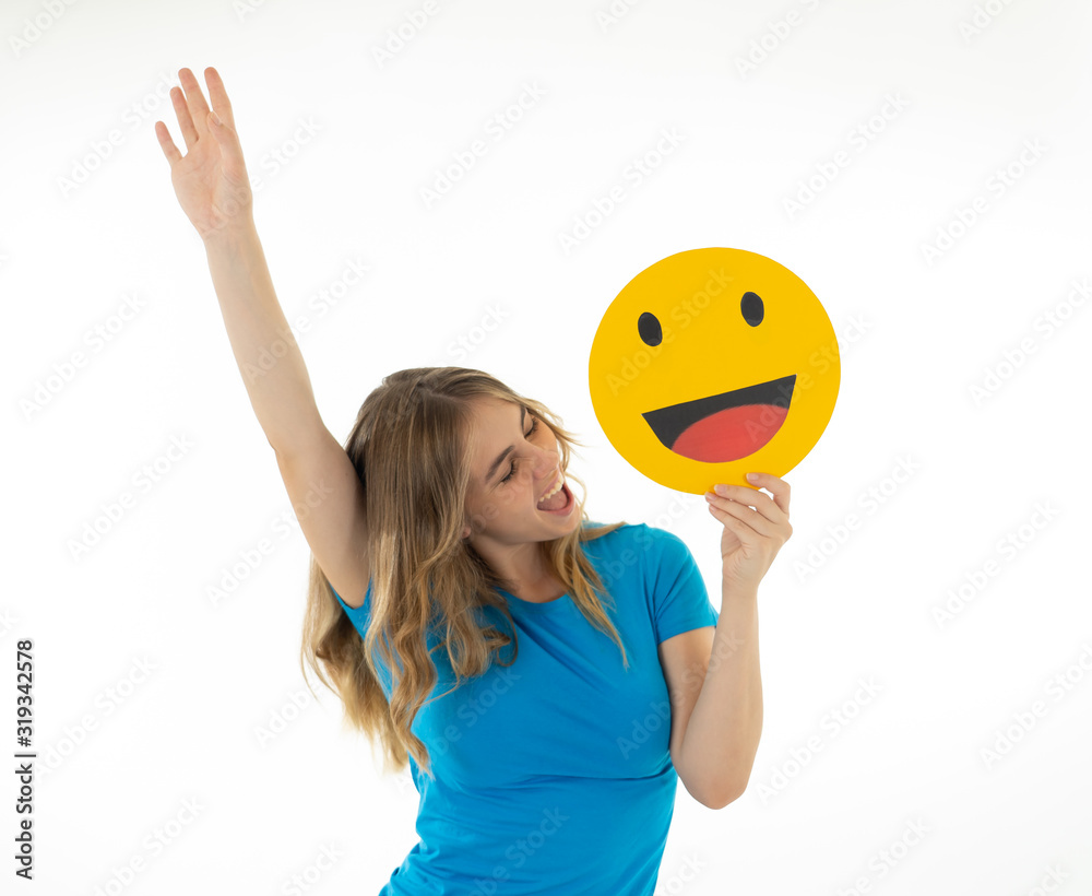Beautiful young woman holding happy face emoji emoticon social media ...