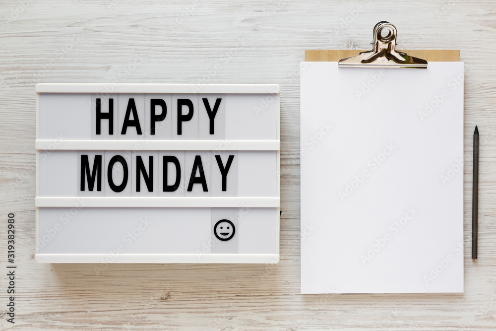 'Happy monday' words on a modern board, clipboard with blank sheet of ...