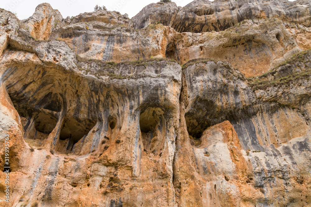 Limestone cliffs with caves Stock Photo | Adobe Stock