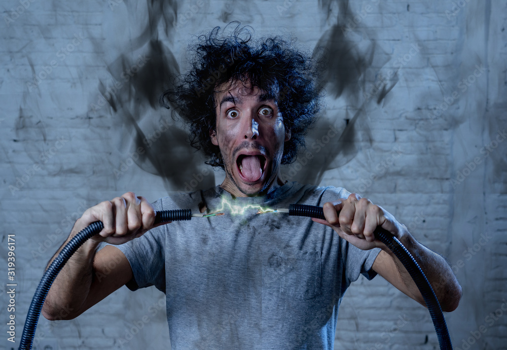 Funny image of man getting electric shock with funny face and smoke all ...