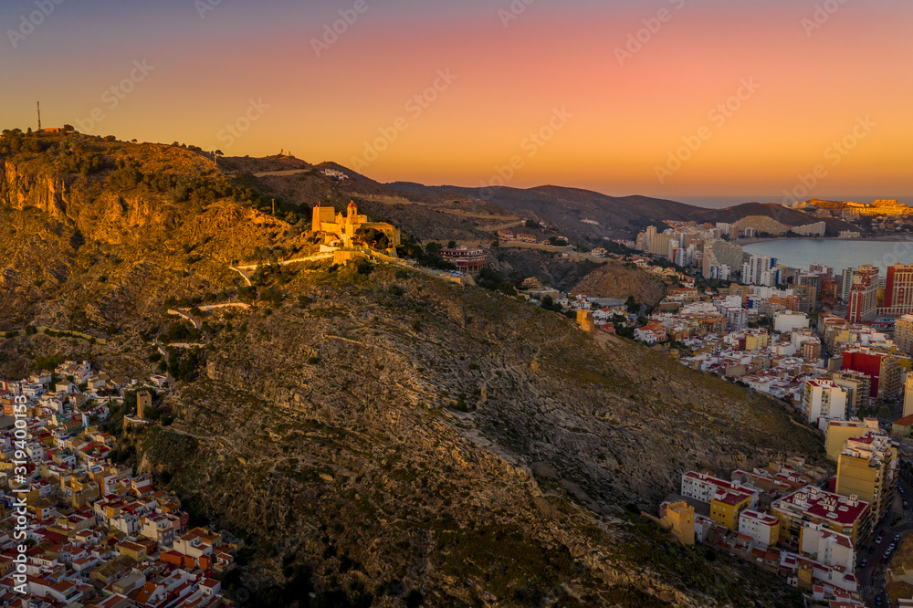 Cullera castle and church on a hilltop overlooking the popular summer ...