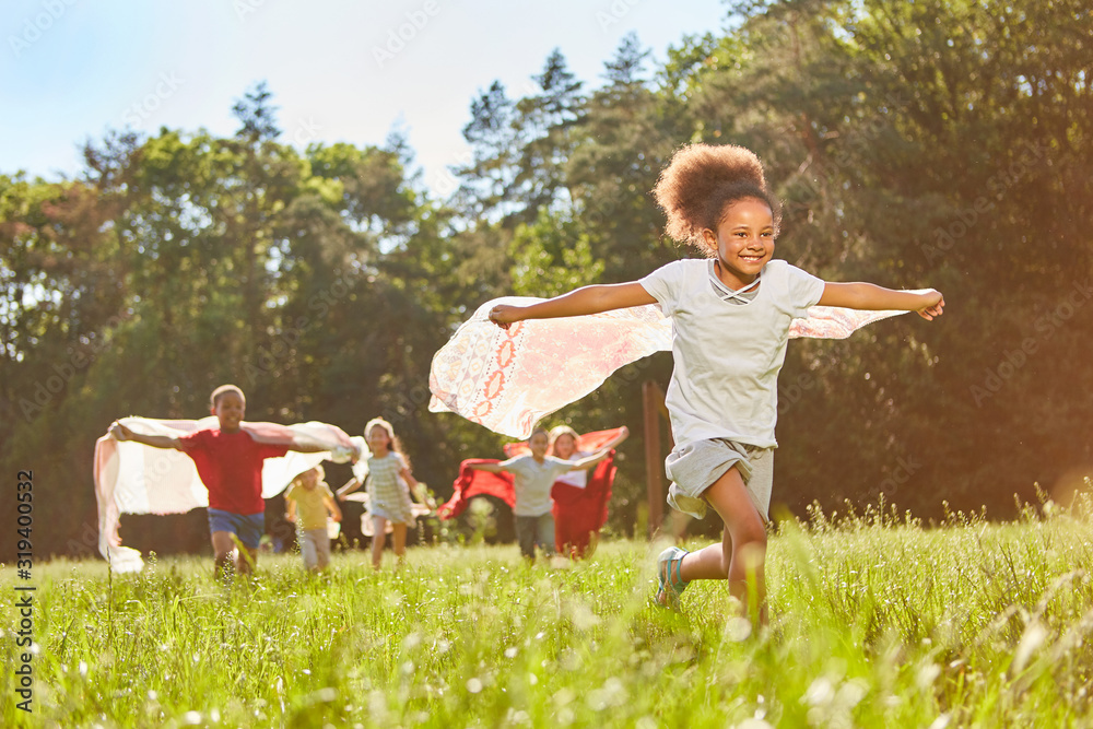 African girl is running with a towel Stock Photo | Adobe Stock