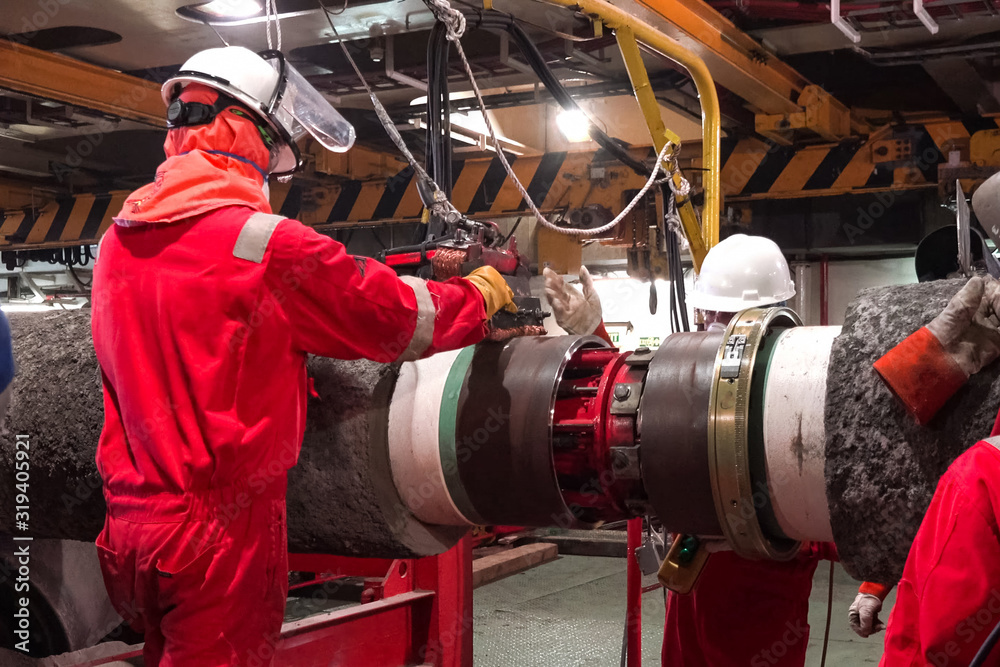 Welding the pipeline for laying on the seabed. Work in a pipe layer ...