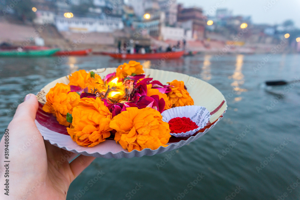 Small pooja plate with candle and flowers in the hand. Small ...